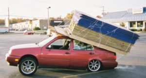 Overfilled Car - Dejana Truck & Utility Equipment